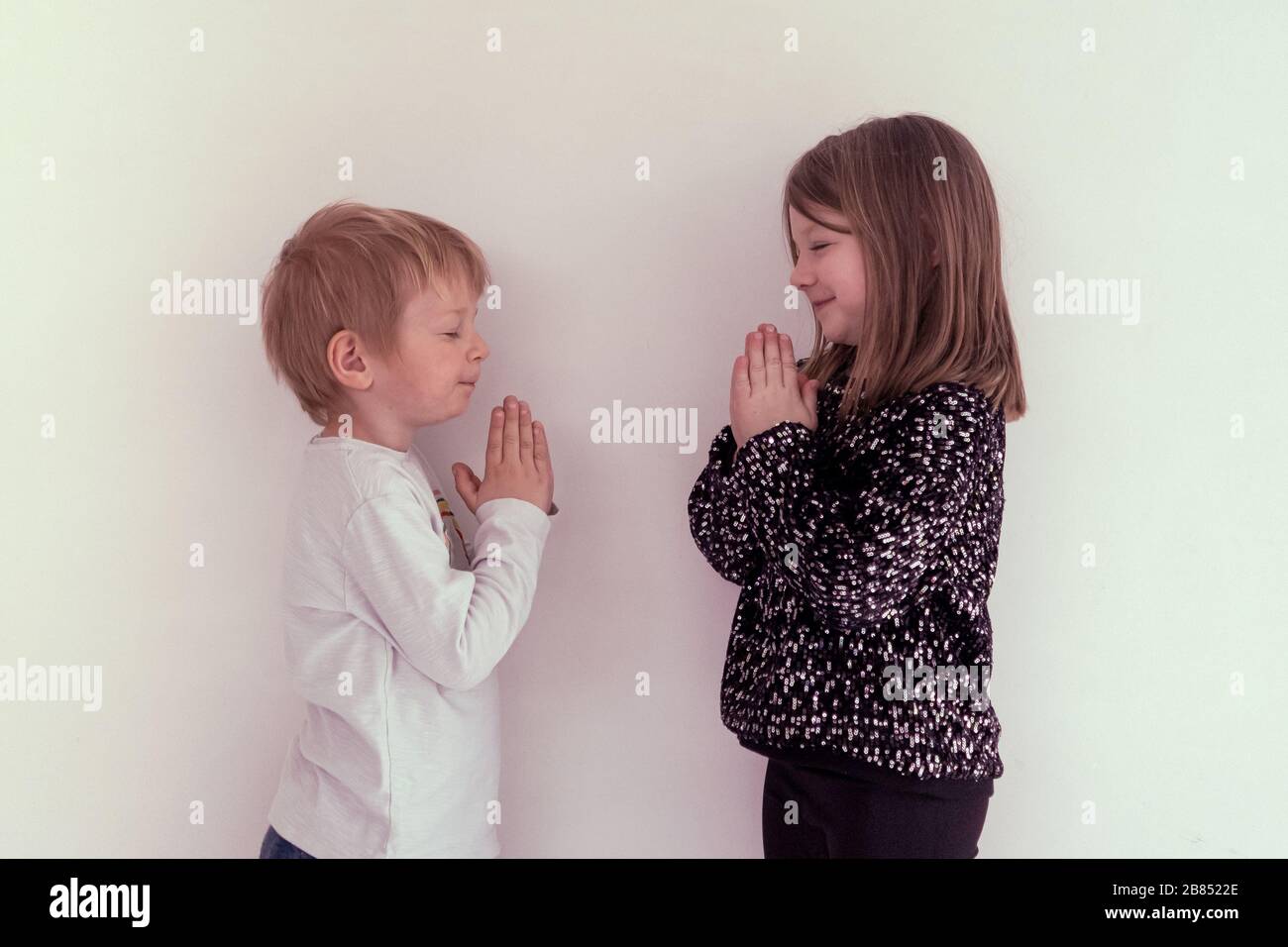 children performing namaste greetings in time of coronavirus pandemic ...