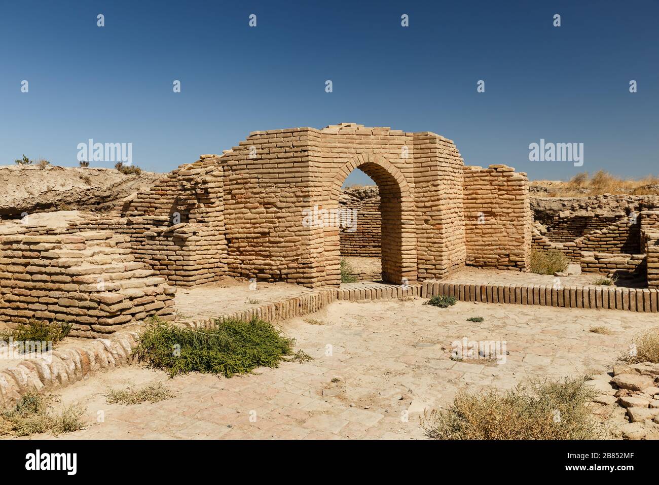 ancient wall and entrance to the building, The ruins of an ancient city ...