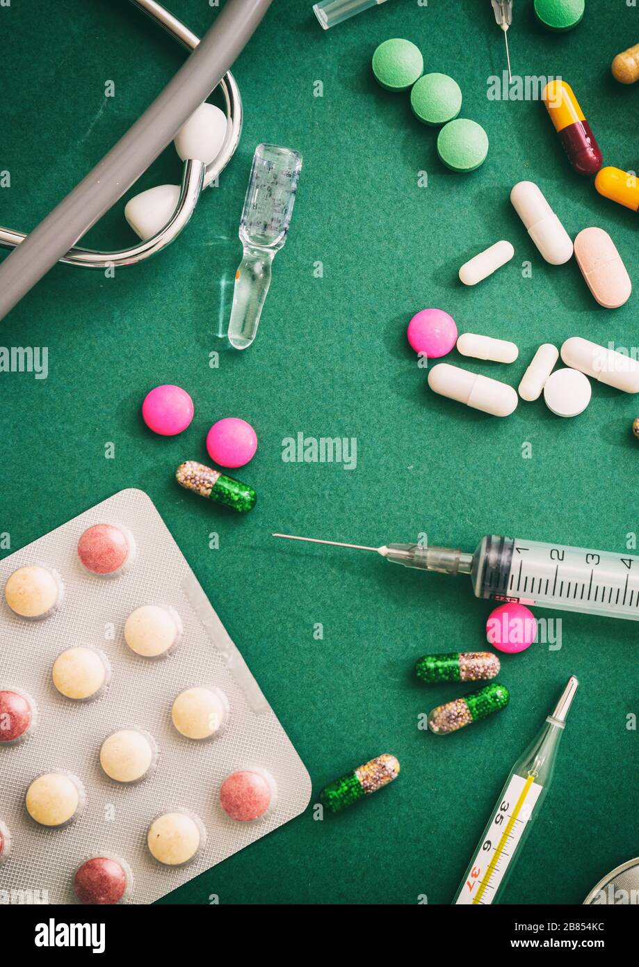 Medical supplies flat lay. Drugs medicine and syringes, stethoscope and ...