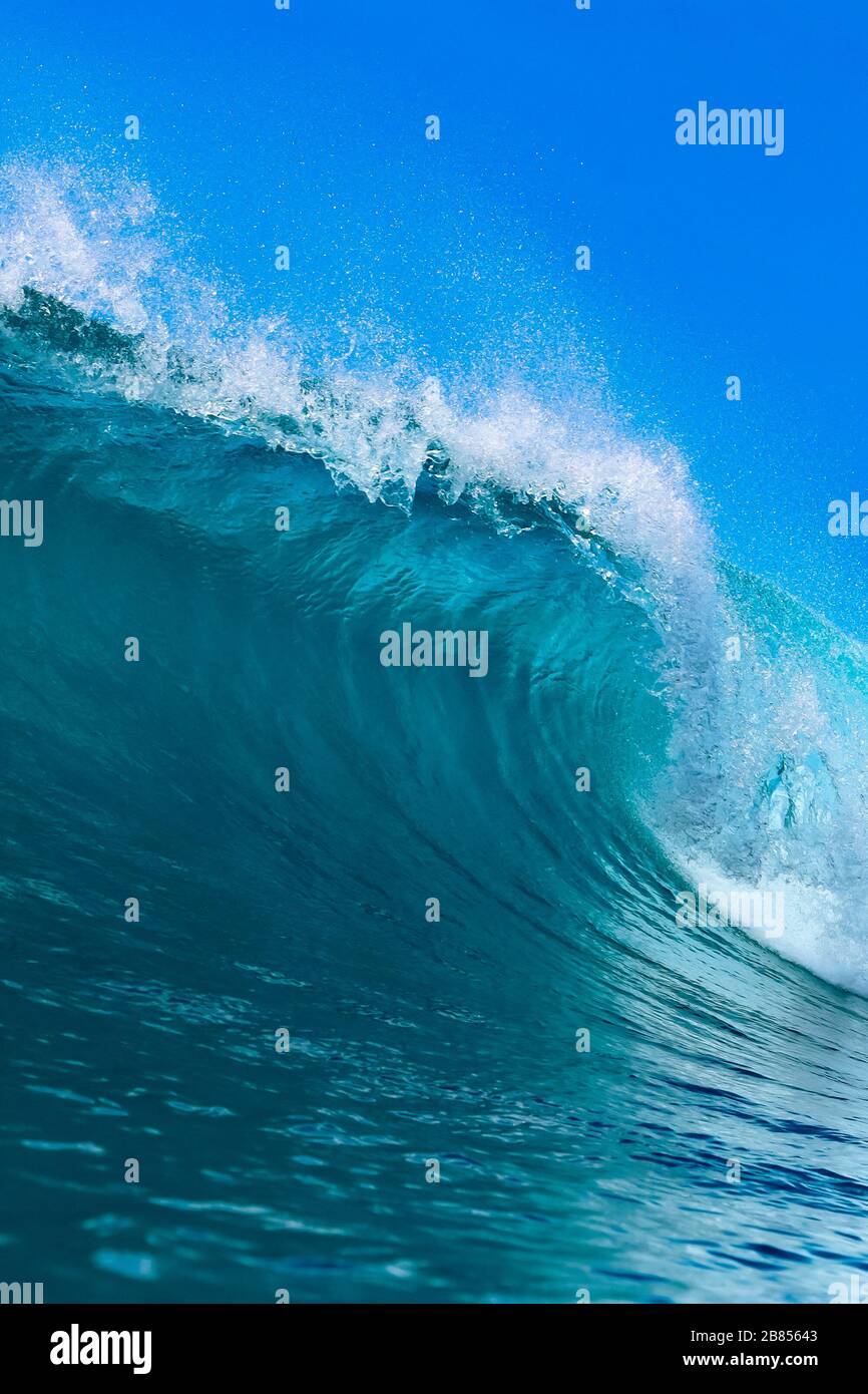 Blue ocean wave under blue sky Stock Photo - Alamy