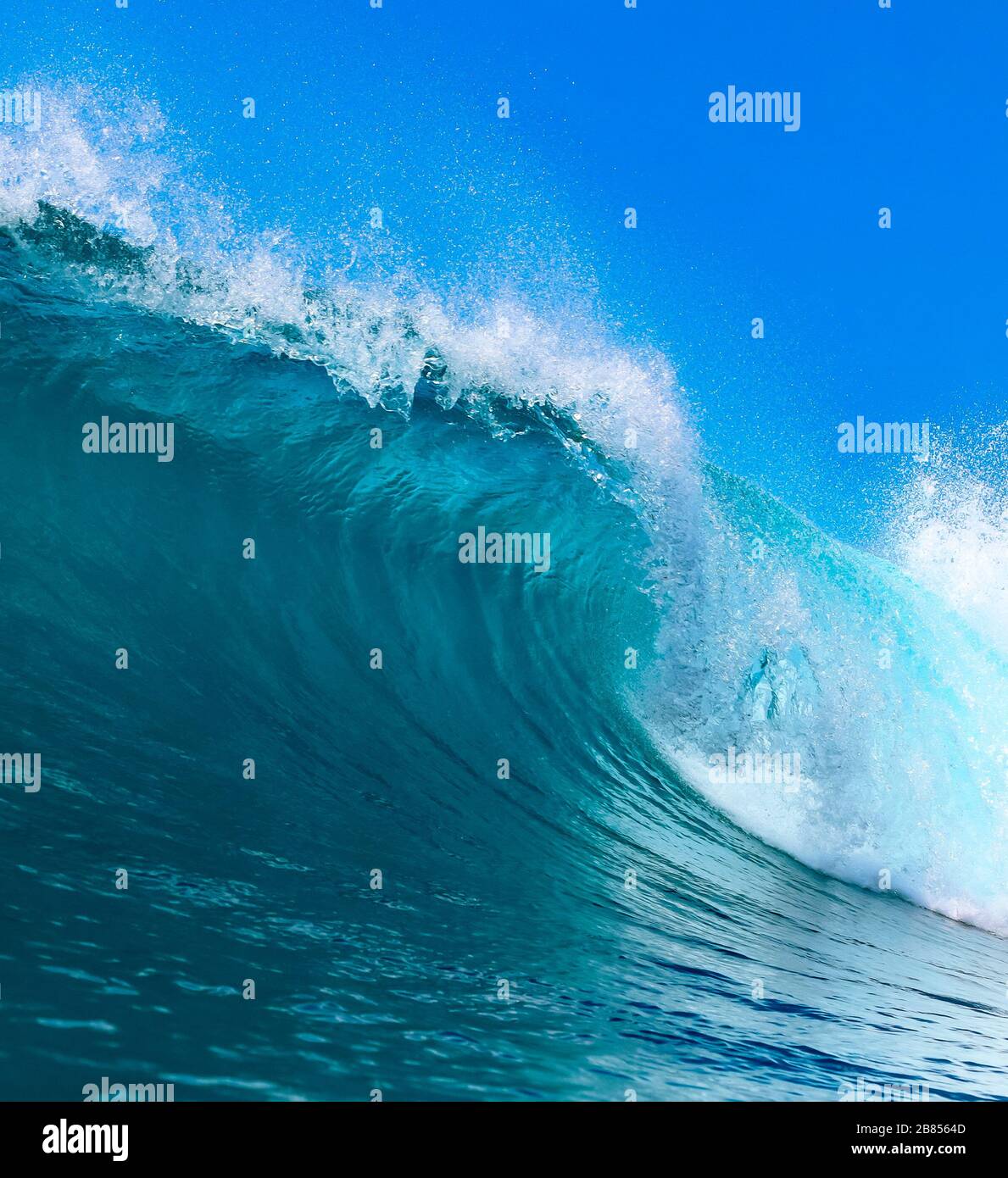 Blue ocean wave under blue sky Stock Photo - Alamy