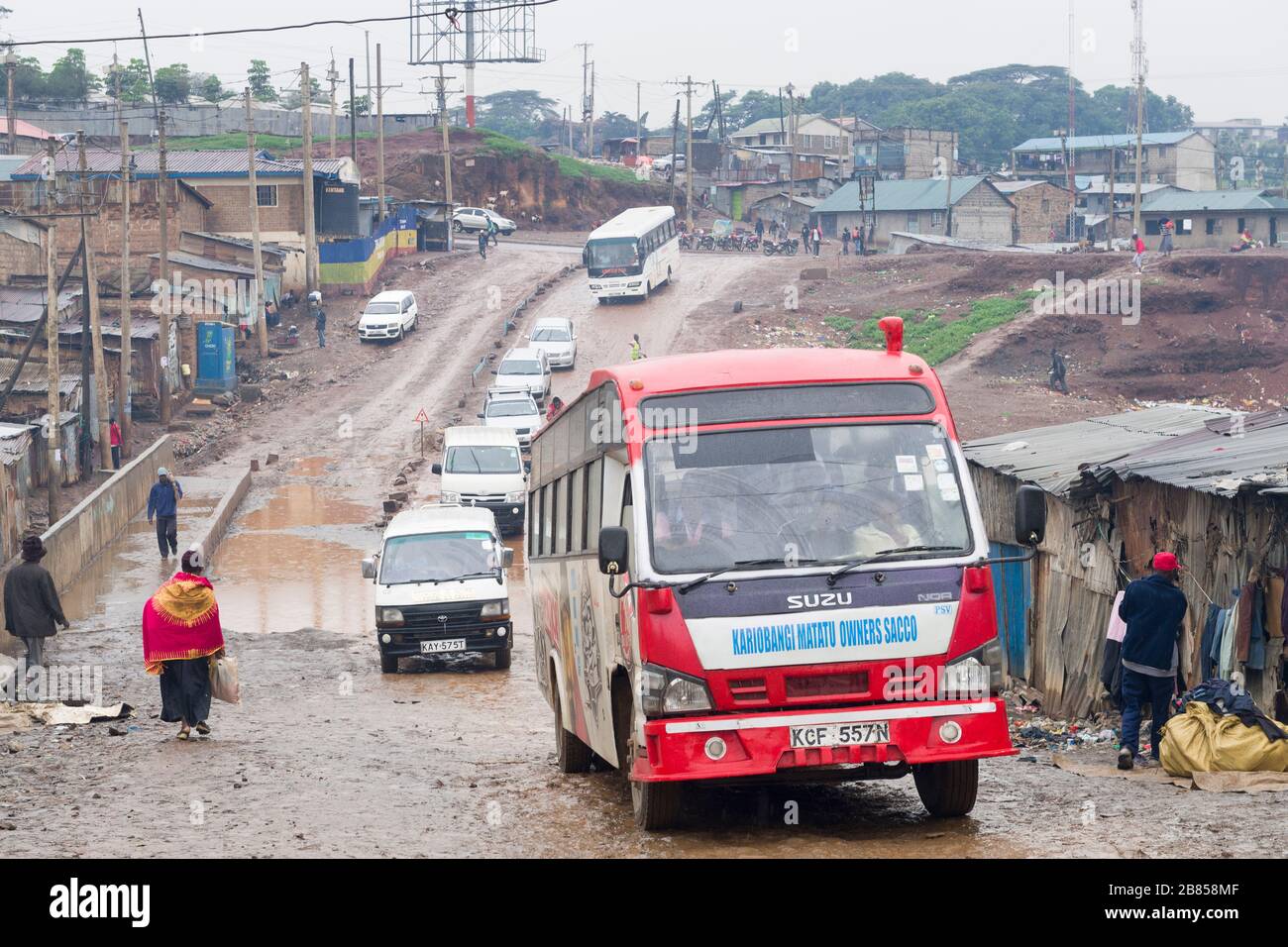 A bus (called a matatu in Kenya) on it route through Mathare slum ...