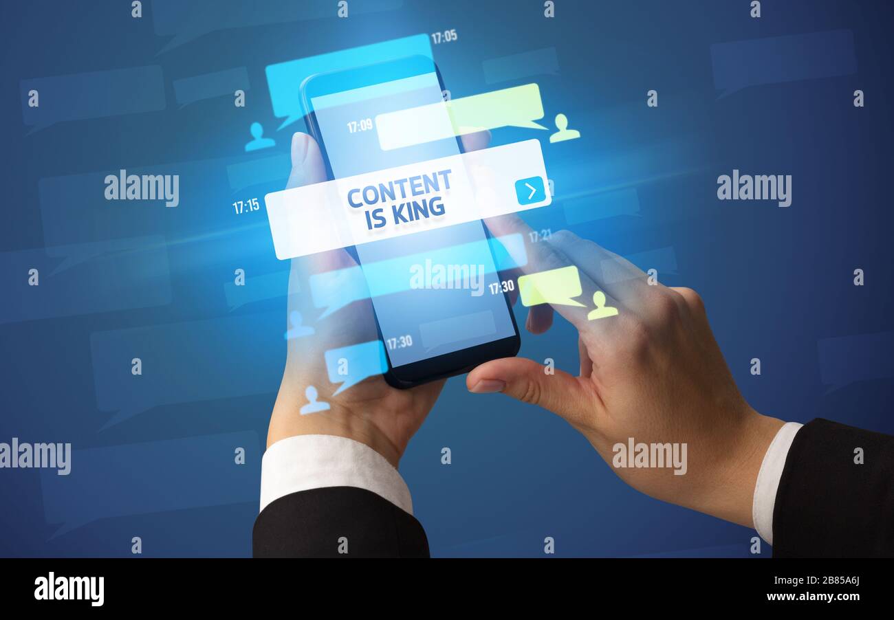Female hand typing on smartphone with CONTENT IS KING inscription ...