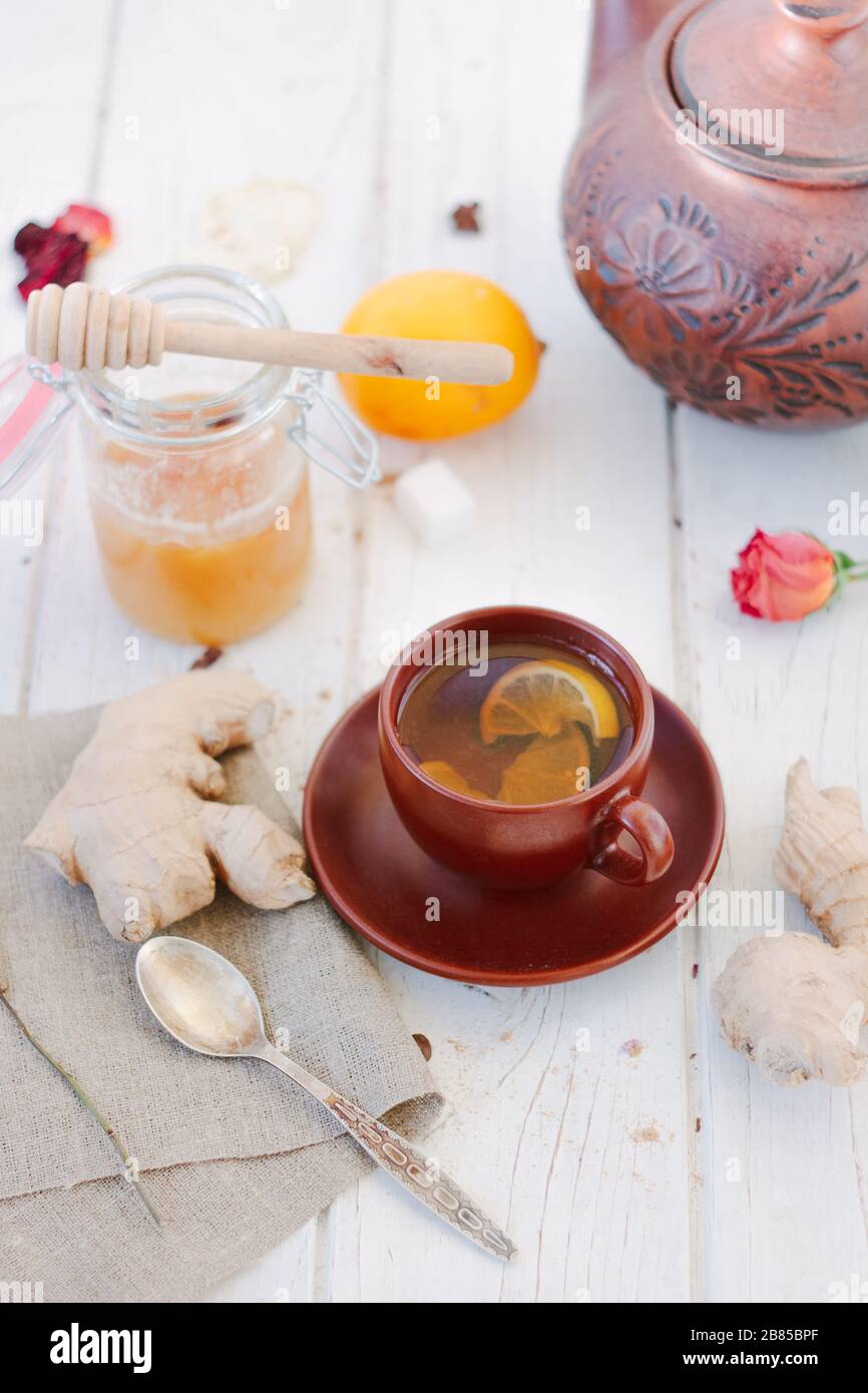 Ginger tea with lemon, lime and honey on white Stock Photo - Alamy