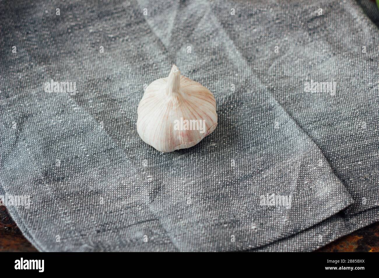 Nice garlic on piece of fabric material Stock Photo - Alamy