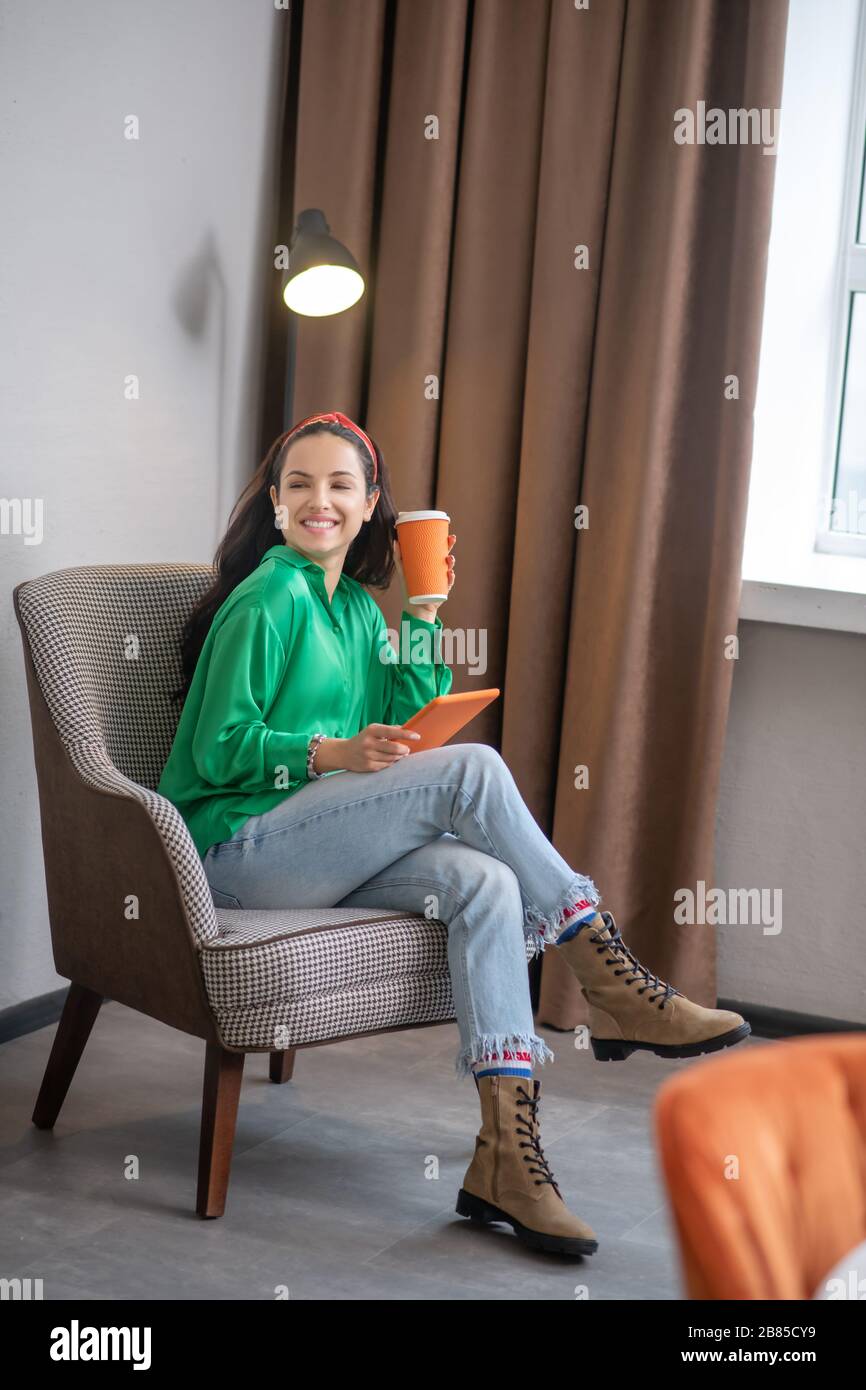Woman sitting cross legged in chair hi-res stock photography and images ...