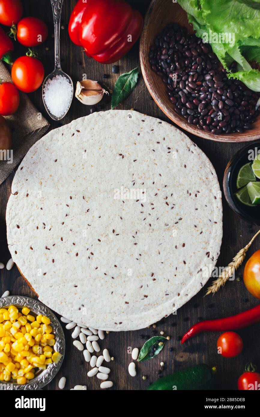 Mexican food - tortilla with vegetables, corn and beans Stock Photo - Alamy