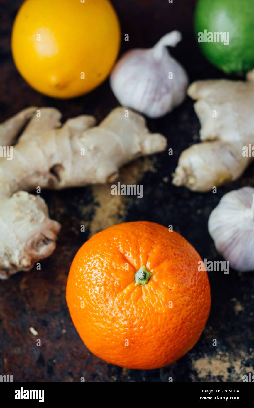 Citrus fruits with garlic and ginger root Stock Photo - Alamy