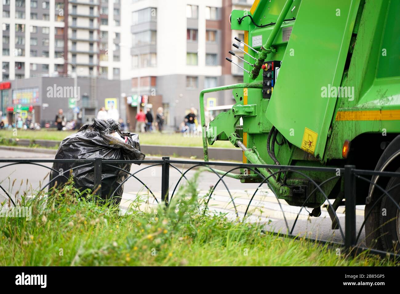 Green Garbage truck into waste emptying for waste disposal, Garbages ...