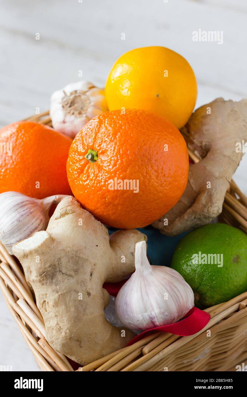 Citrus fruits, garlic and ginger root on basket Stock Photo - Alamy