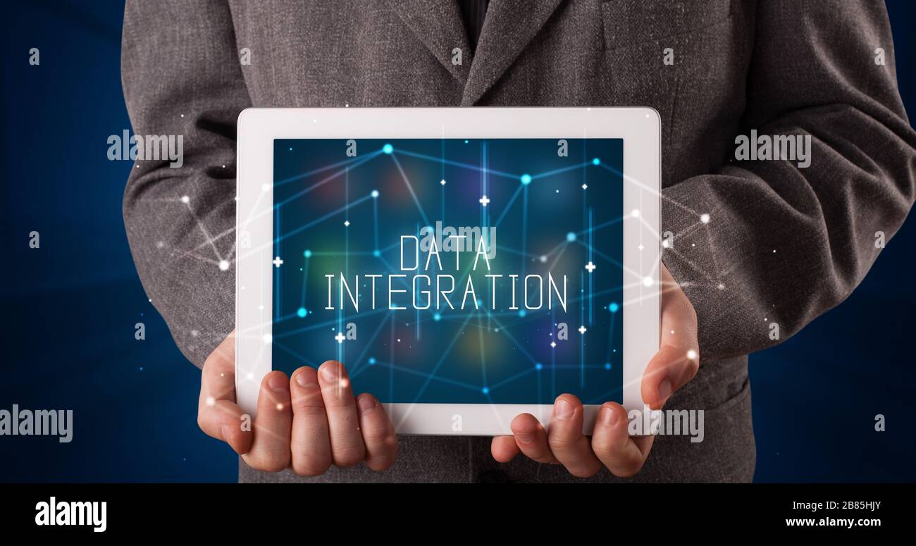 Young business person working on tablet and shows the digital sign ...