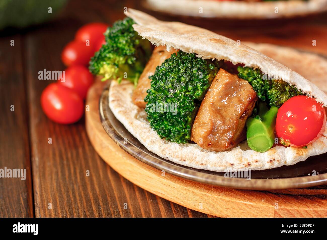 Vegetarian seitan with vegetables inside pita bread Stock Photo - Alamy