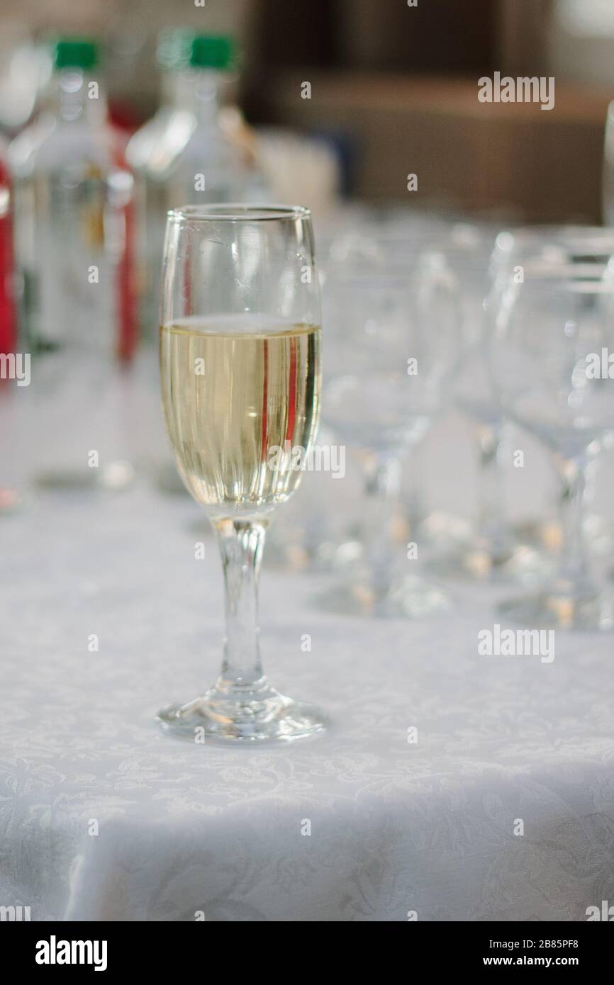 Glass filled by fresh champagne on restaurant Stock Photo - Alamy