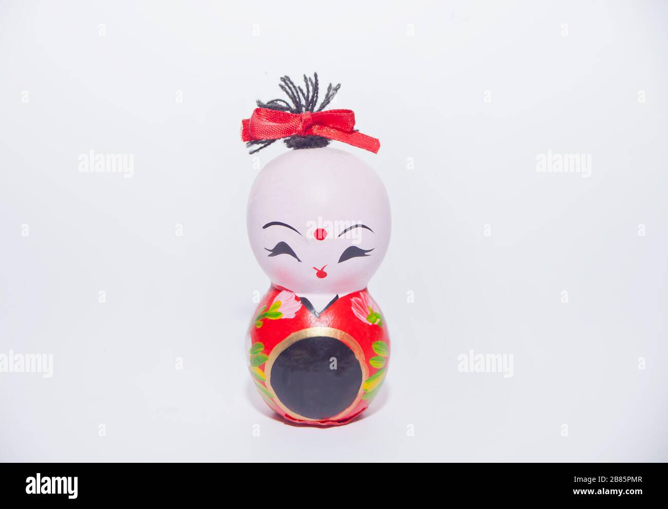 Figurine of chinese girl on the white background Stock Photo - Alamy