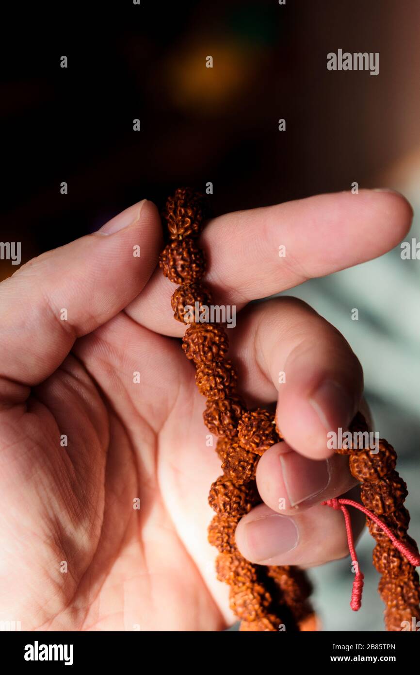 Hand and rudraksha beads hi-res stock photography and images - Alamy