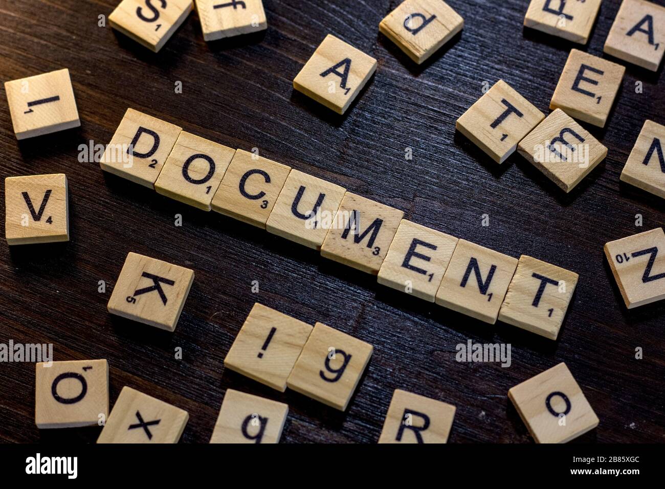Document word made with scrabble letters on a black wooden table Stock ...