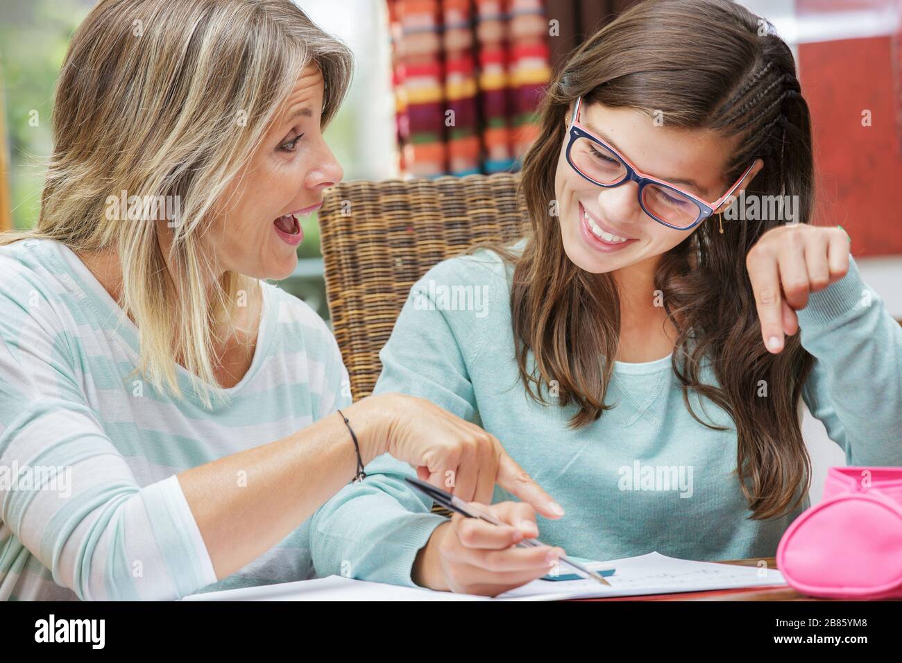 pretty student girl taking tutoring courses with beautiful blond ...