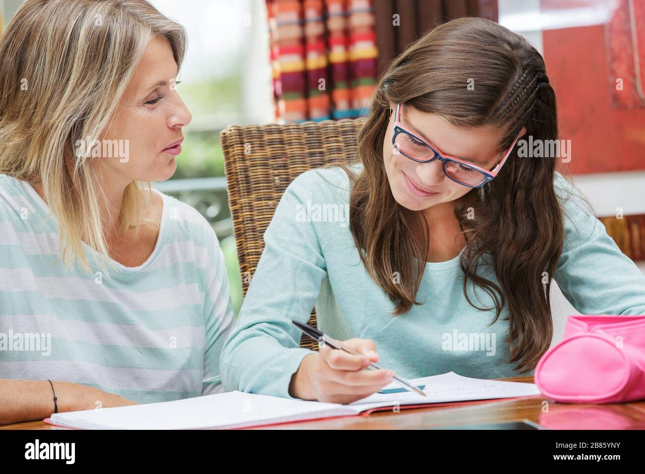 pretty student girl taking tutoring courses with beautiful blond ...