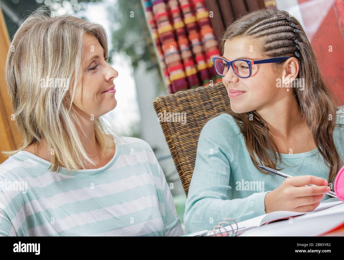 pretty student girl taking tutoring courses with beautiful blond ...