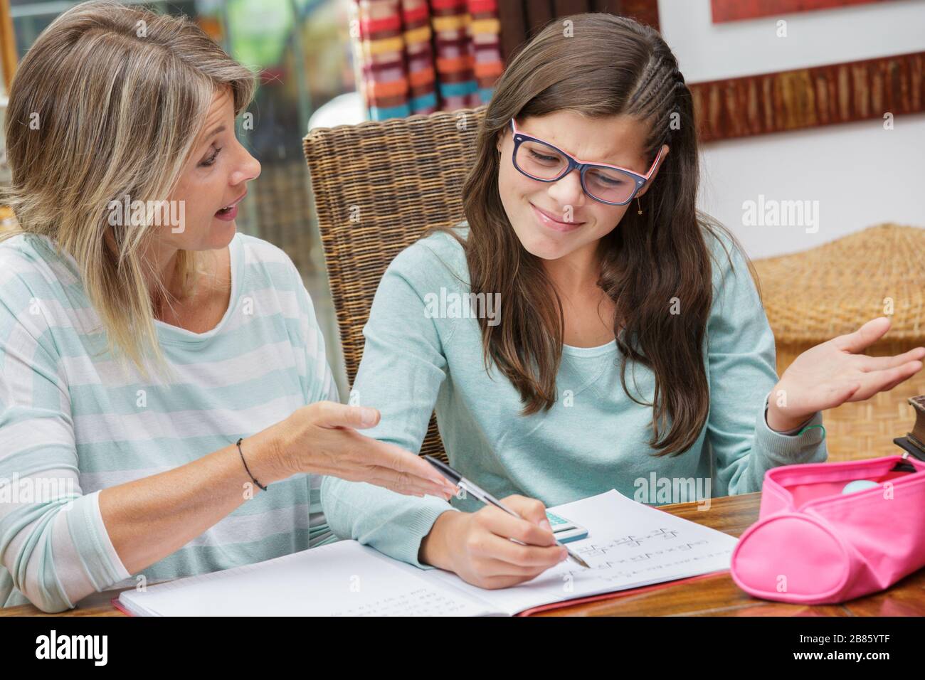 pretty student girl taking tutoring courses with beautiful blond ...