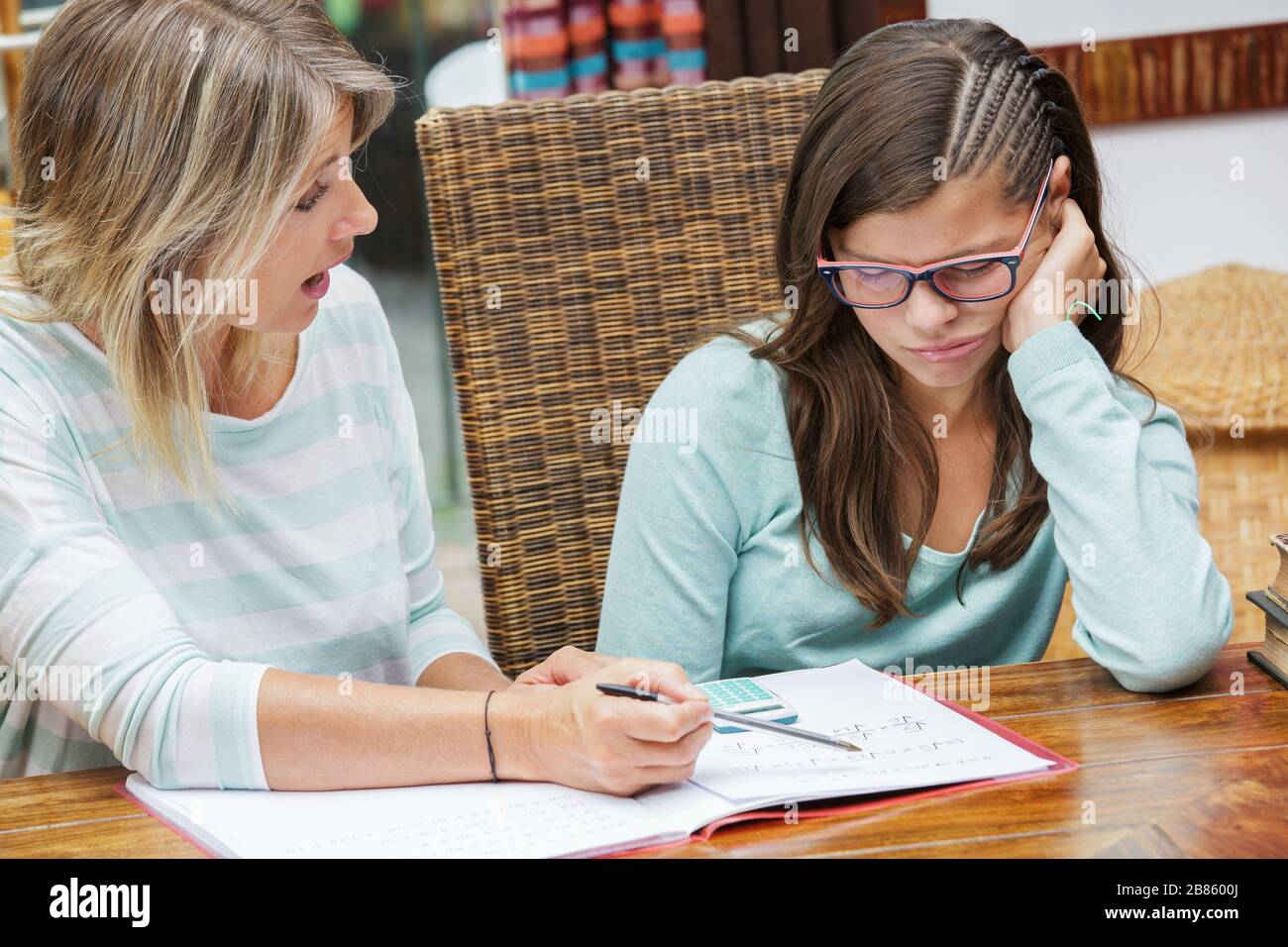 pretty student girl taking tutoring courses with beautiful blond ...