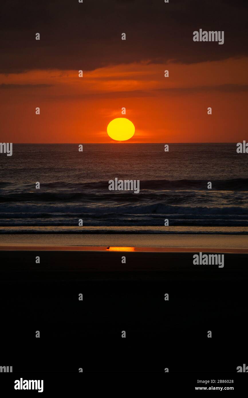 red sunset by the beach Stock Photo - Alamy