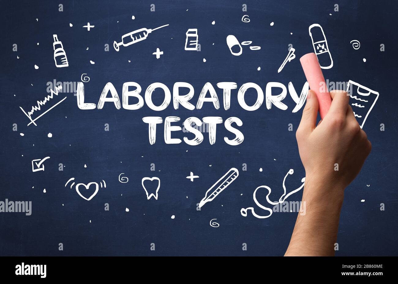 Hand drawing LABORATORY TESTS inscription with white chalk on ...