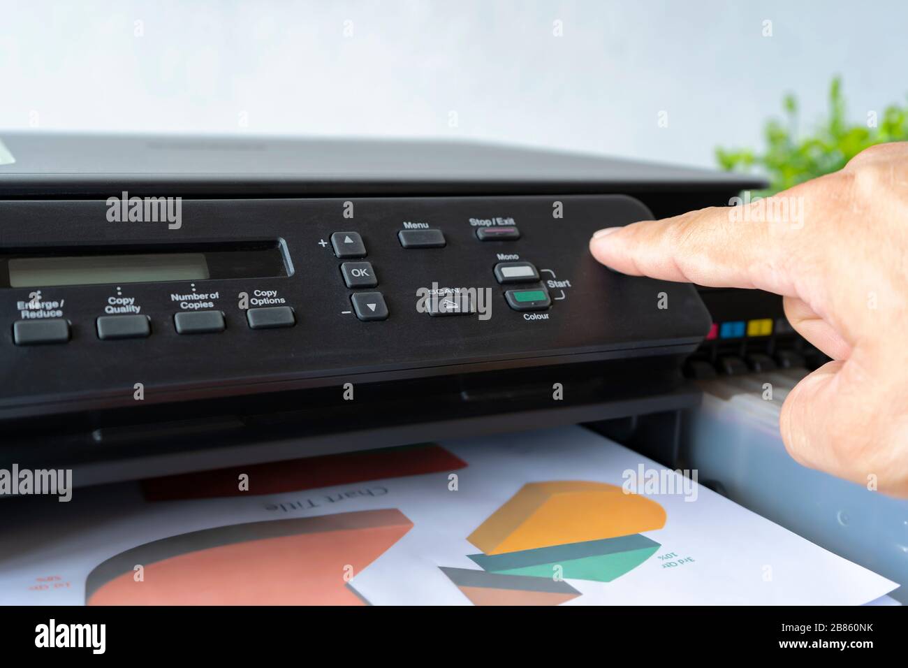 Fingers that are pressing the button, The printer is fully functional ...