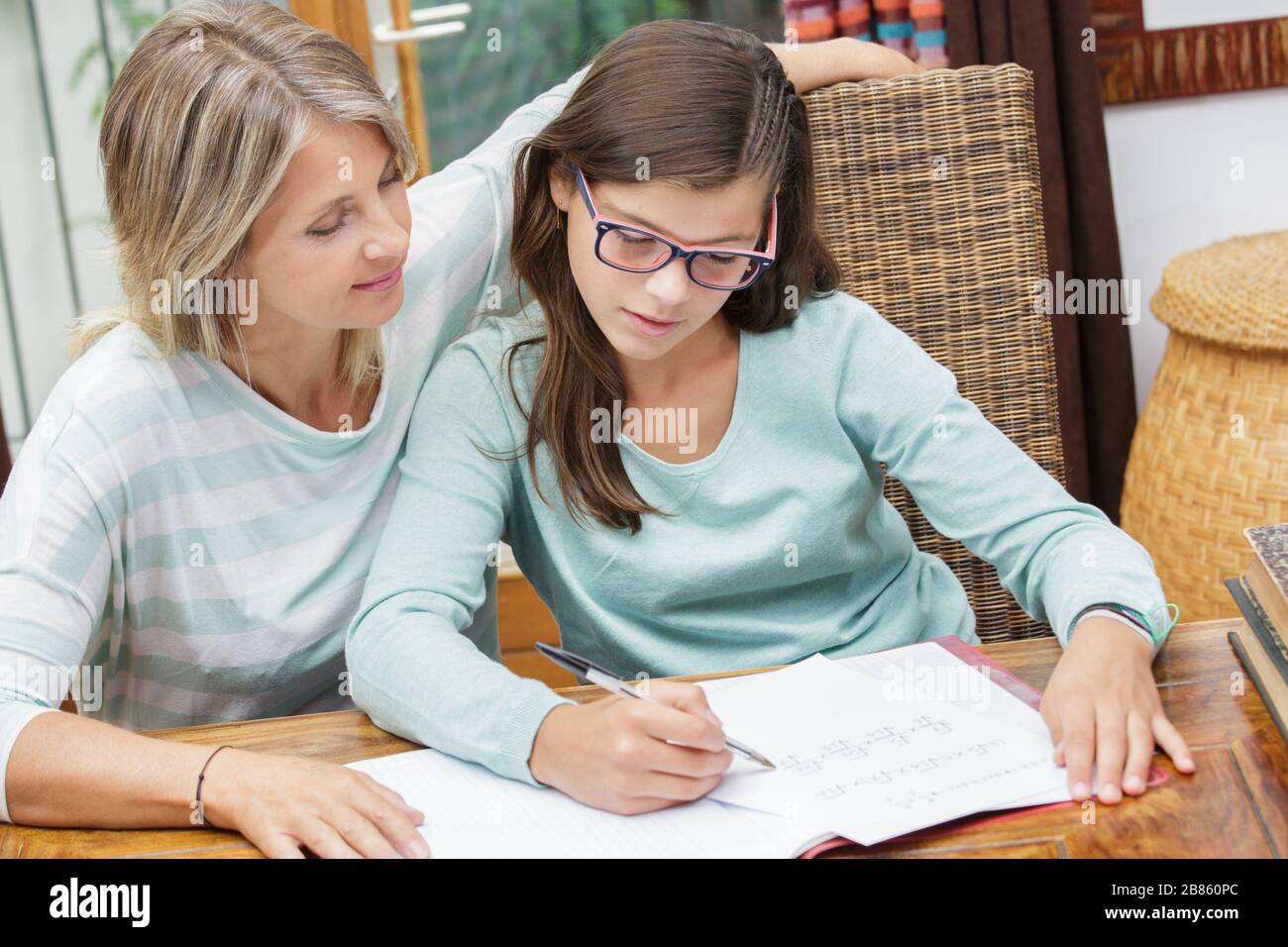 pretty student girl taking tutoring courses with beautiful blond ...