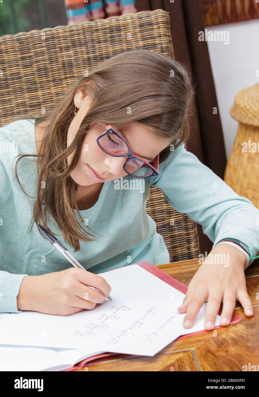 pretty student girl doing homework at home Stock Photo - Alamy