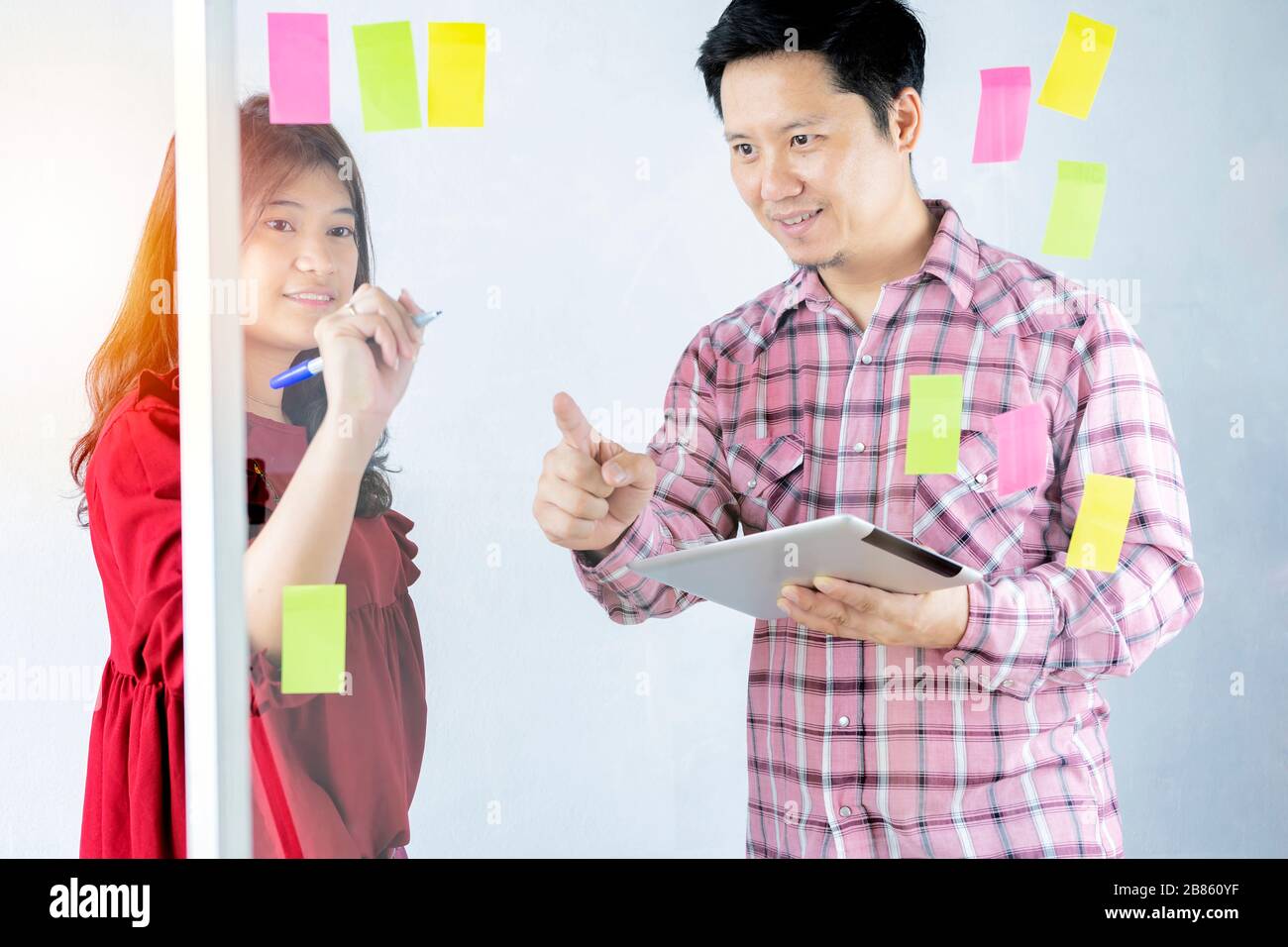 Business people meeting at office and use post it notes to share idea ...