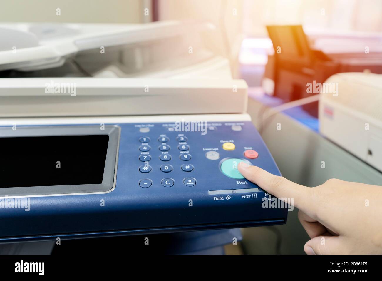 Fingers that are pressing the button, The printer is fully functional ...