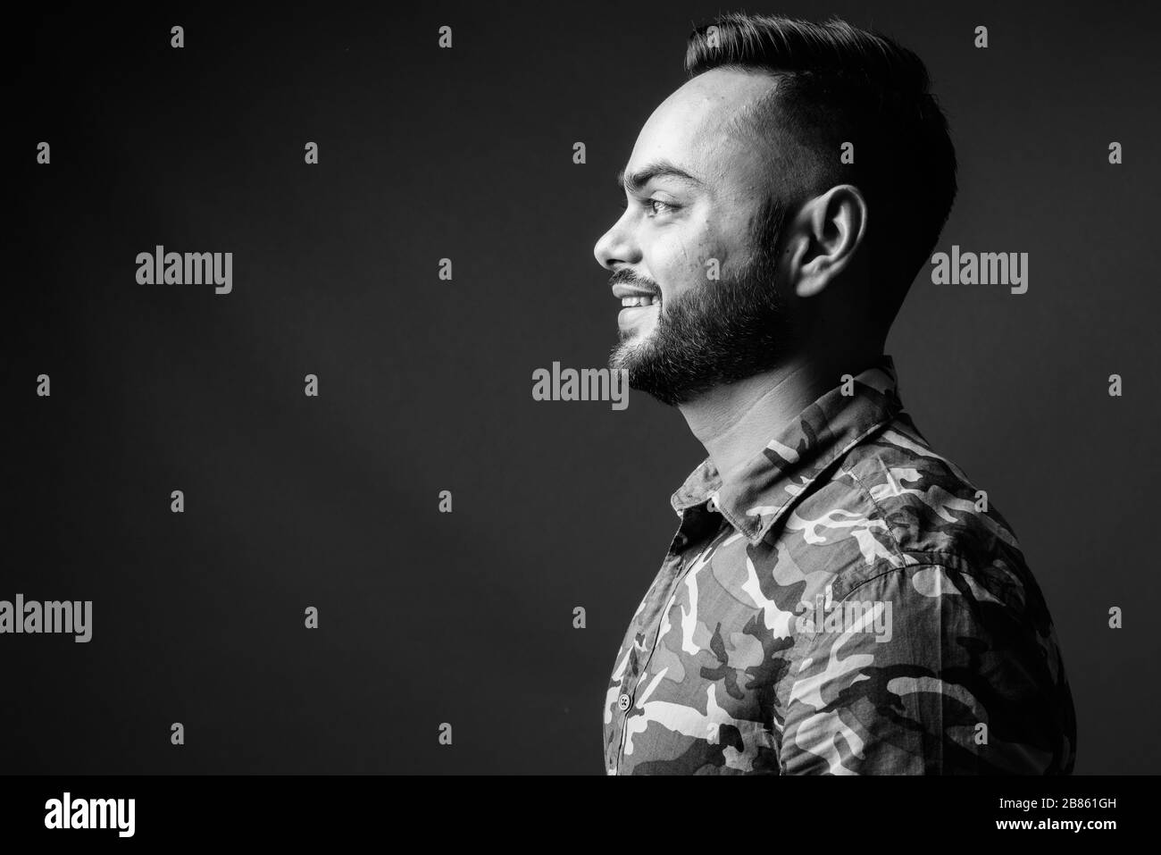 Indian young happy men side view Black and White Stock Photos & Images ...