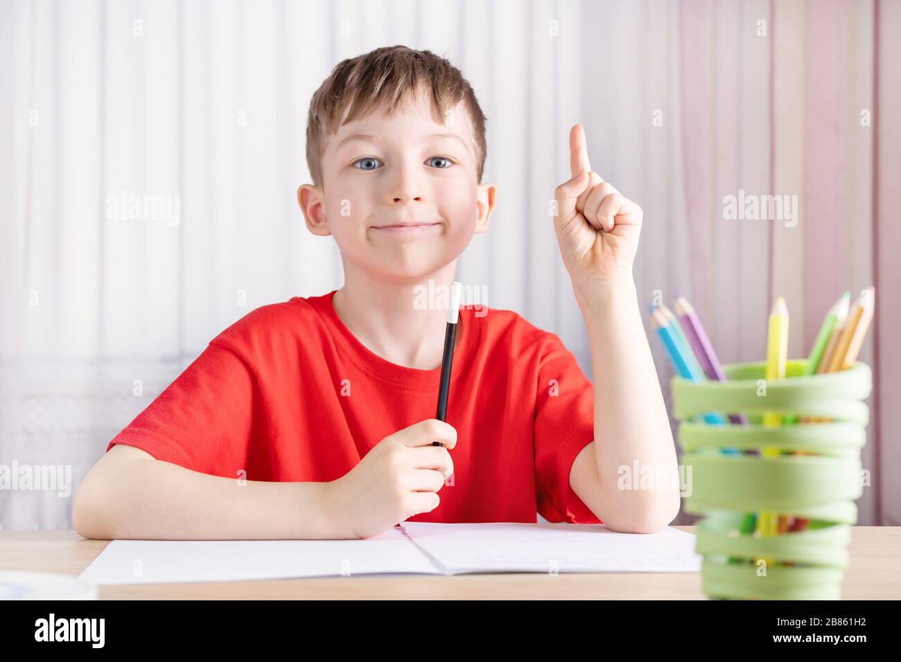 Boy thinking pencil hi-res stock photography and images - Alamy