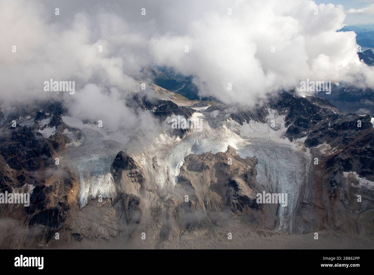 Panoramic aerial view of the mountain range and glaciers through the ...