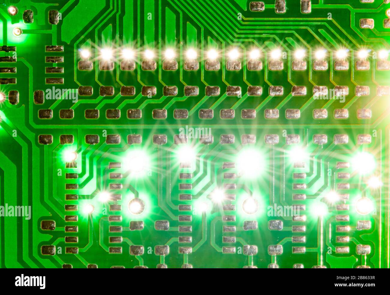 Close up photo of pcb printed circuit board electric with light flash ...