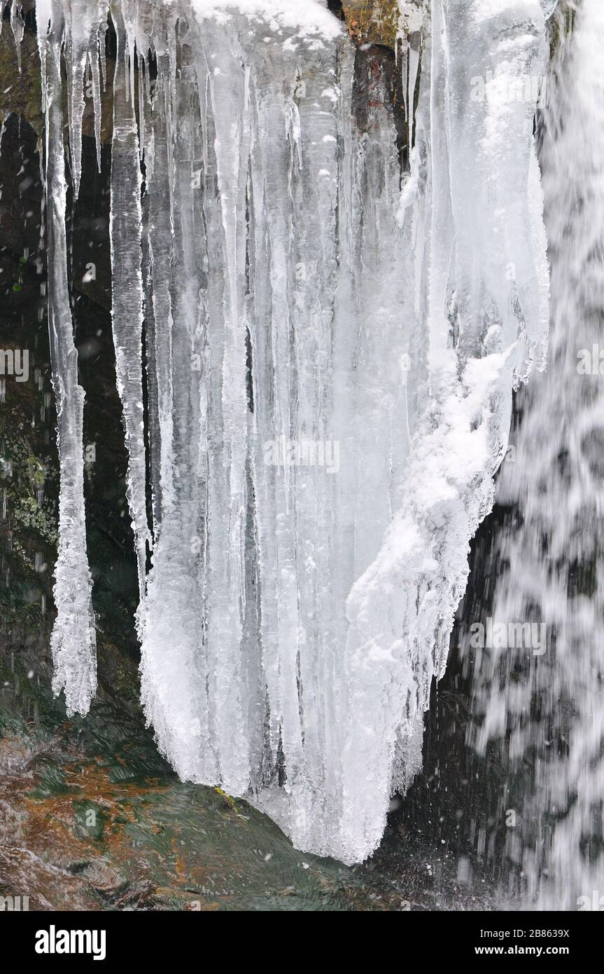 Beautiful mountain waterfall covered in ice. Winter landscape. Frozen ...