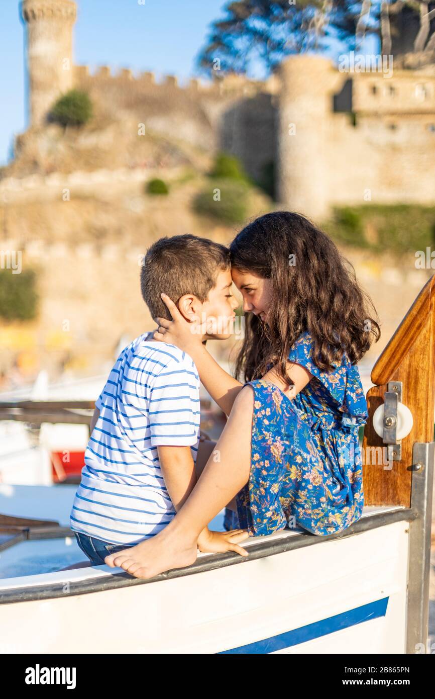 Two little kids hugging in summer time Stock Photo - Alamy