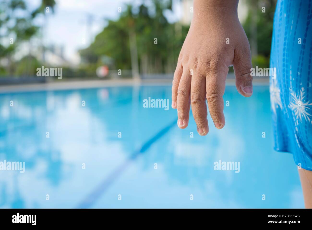 Children swimming in the pool on vacation, she was swimming for a long ...