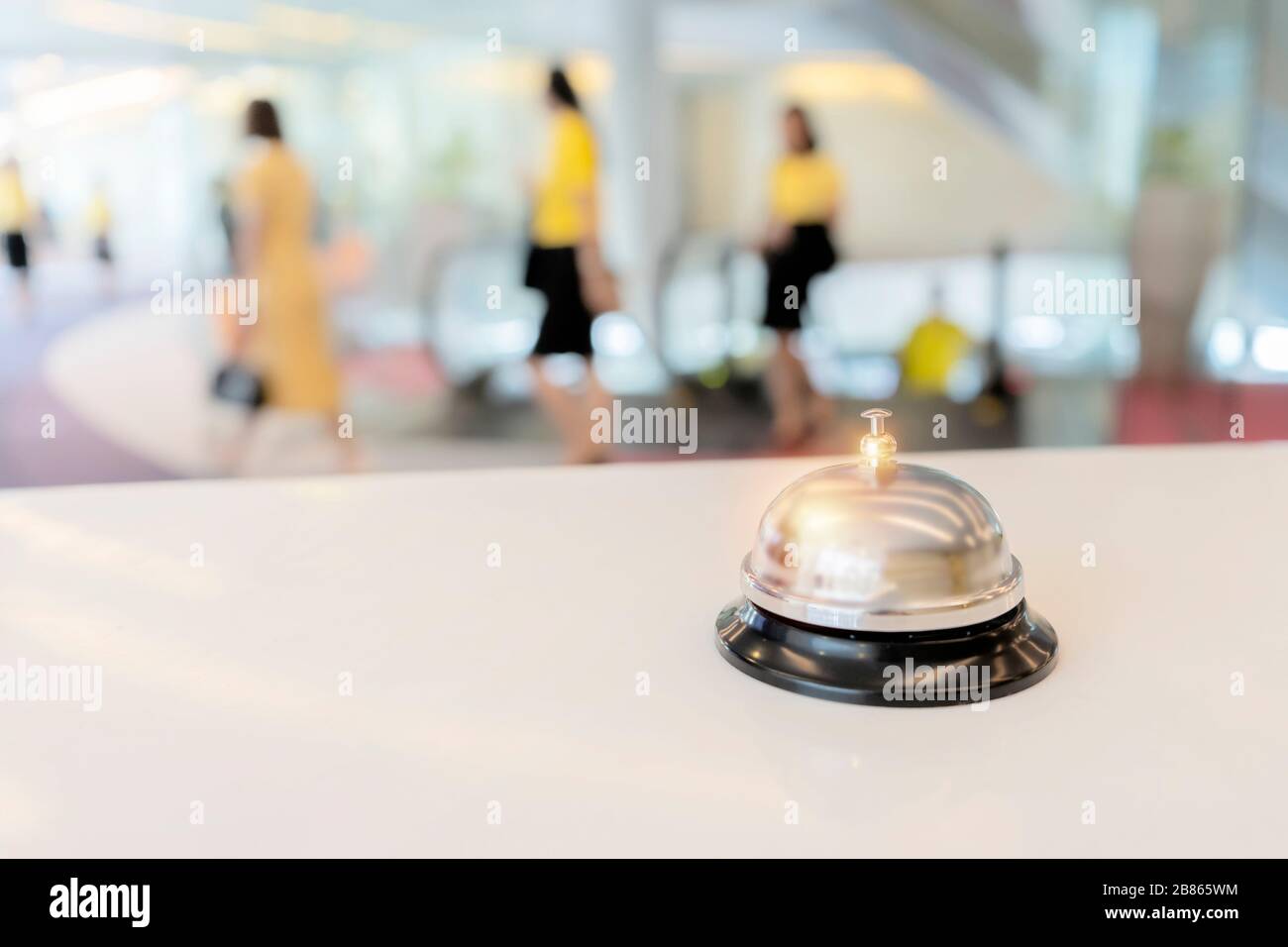 Hotel service bell on a table white glass and simulation hotel ...