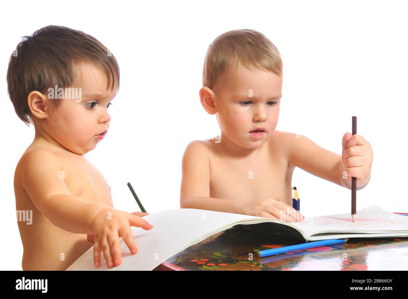 Portrait of playful brother and sister play with colorful pencils ...