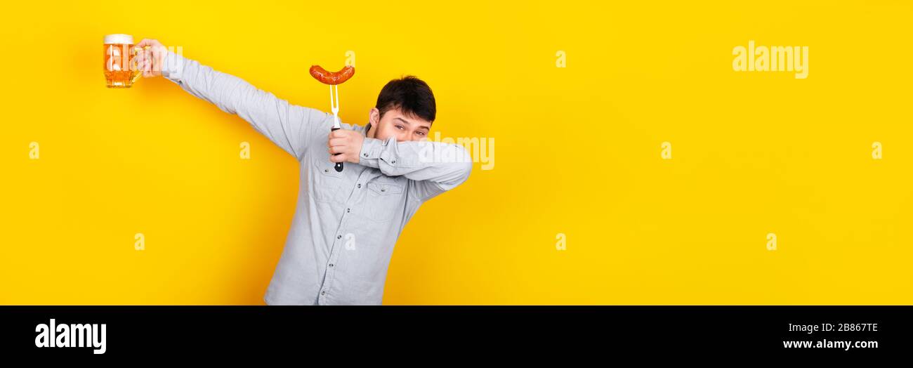 trendy alcoholic with beer standing in dab dance pose over yellow ...