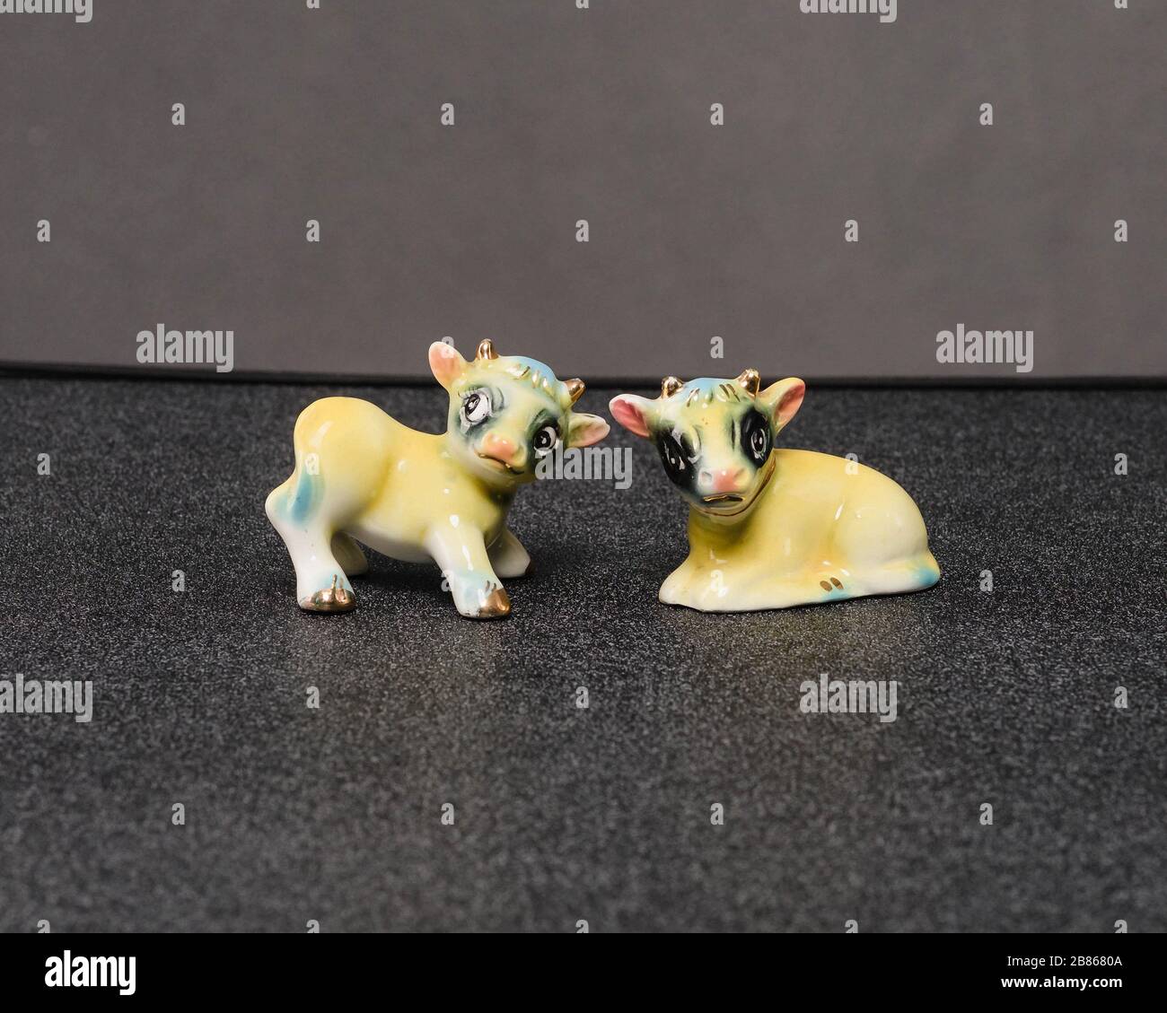 a sculpture of two small yellow calves of unknown origins Stock Photo ...