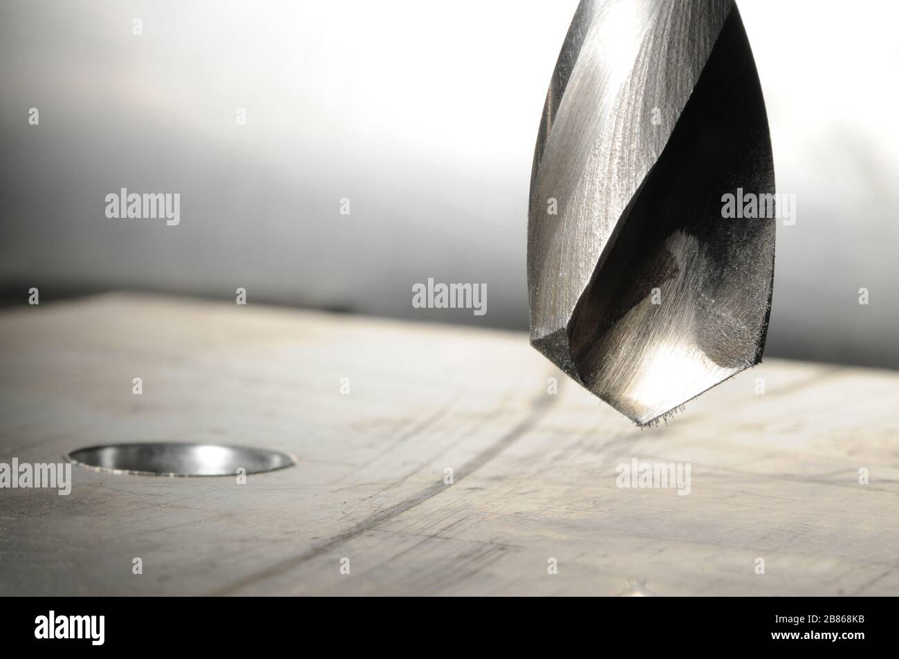 Metal drill tool silver color, close-up photo, scratched metal surface ...