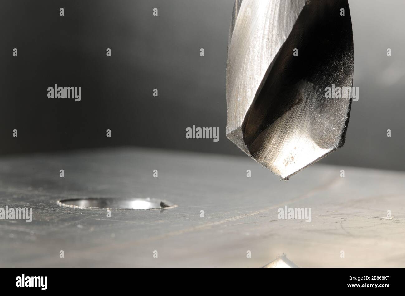 Metal drill tool silver color, close-up photo, scratched metal surface ...