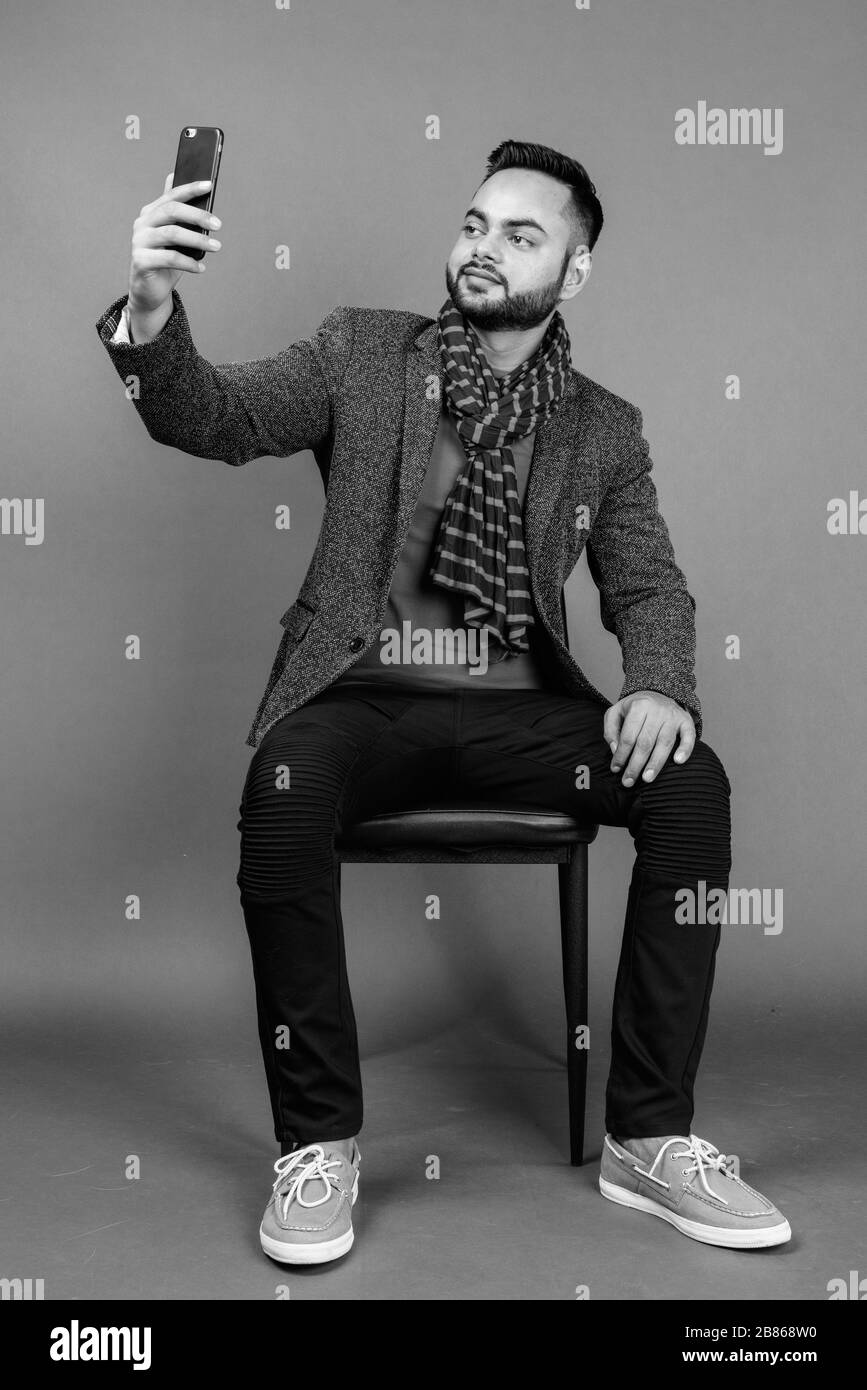 Man sitting indian style Black and White Stock Photos & Images - Alamy