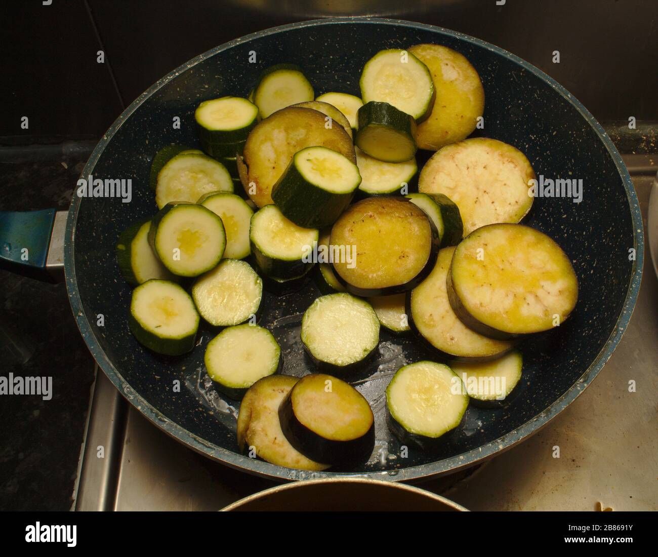 Sliced cooked courgette Stock Photo - Alamy