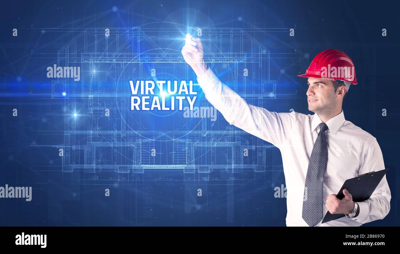 Handsome architect with helmet drawing VIRTUAL REALITY inscription, new ...