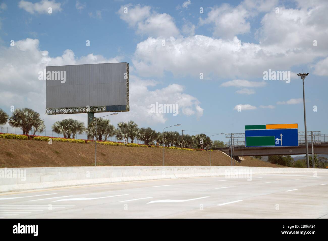 Large gray outdoor advertising signs On the side of the highway or ...