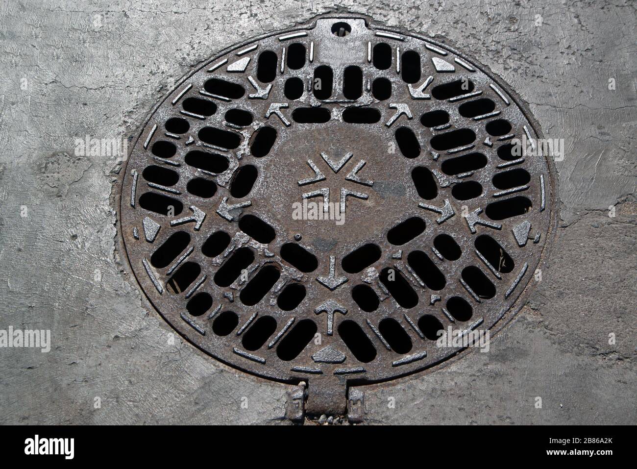 Manhole cover has rust on the street Stock Photo - Alamy